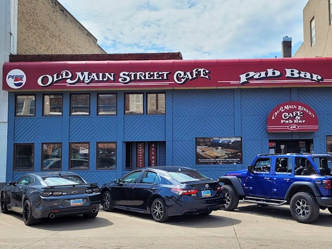 Old Main Street Cafe's bold blue exterior pops against the skyline like a delicious bookmark in Devils Lake's story.