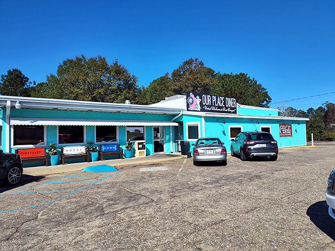 Our Place Diner's turquoise exterior pops against the Alabama sky – as vibrant as the personalities inside.