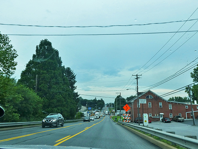 Country roads wind through landscapes so perfect they make Windows screensavers look like amateur photography.
