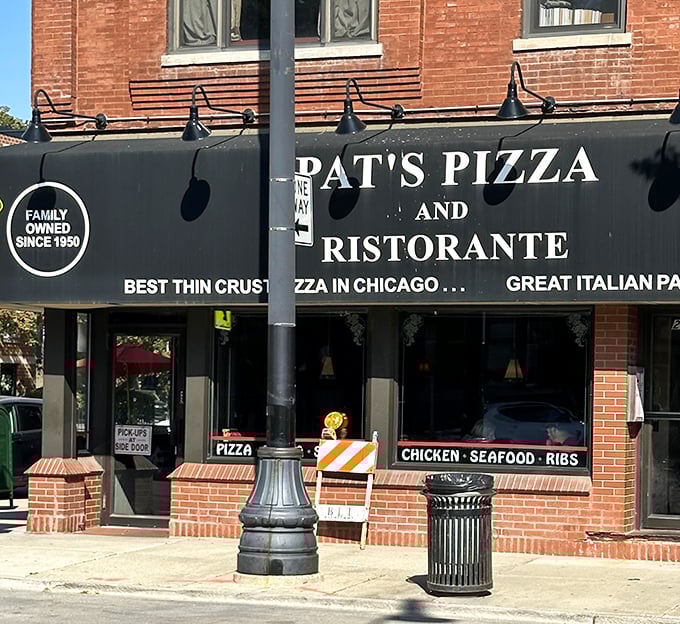 Pat's Pizza proudly announces its thin-crust supremacy on a sign that's been making mouths water since 1950.