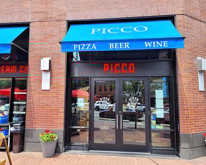 Picco's bright blue awning promises a modern twist on pizza perfection. Spoiler alert: promises kept!