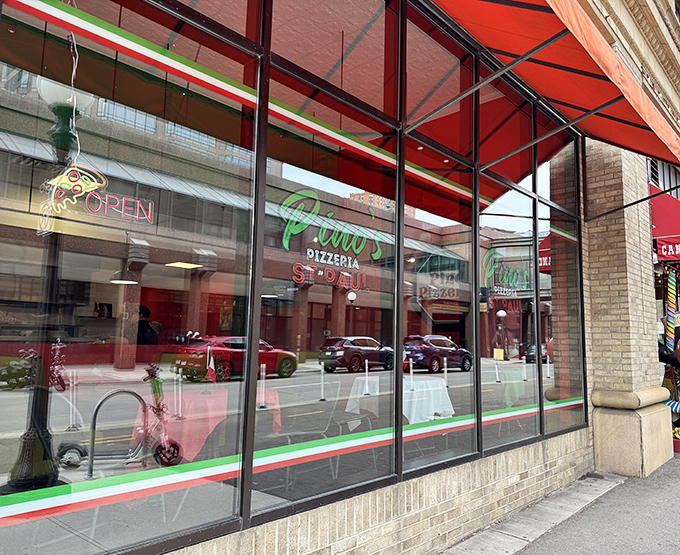 Pino's downtown windows frame pizza perfection like a delicious work of edible art.