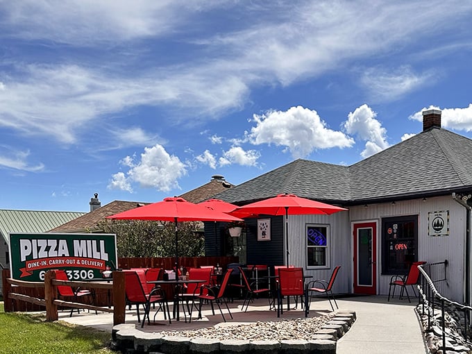 Cottage-style charm with bright red furniture that says, "Yes, we take pizza seriously, but we're having fun doing it."