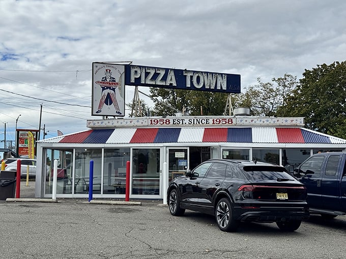 Pizza Town's retro diner vibes scream "authentic American pizza experience" louder than any fancy restaurant.