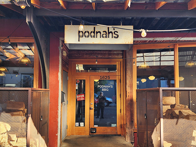 Podnah's entrance feels like walking into barbecue's promised land. Those wooden doors might as well be gates to smoked meat paradise.
