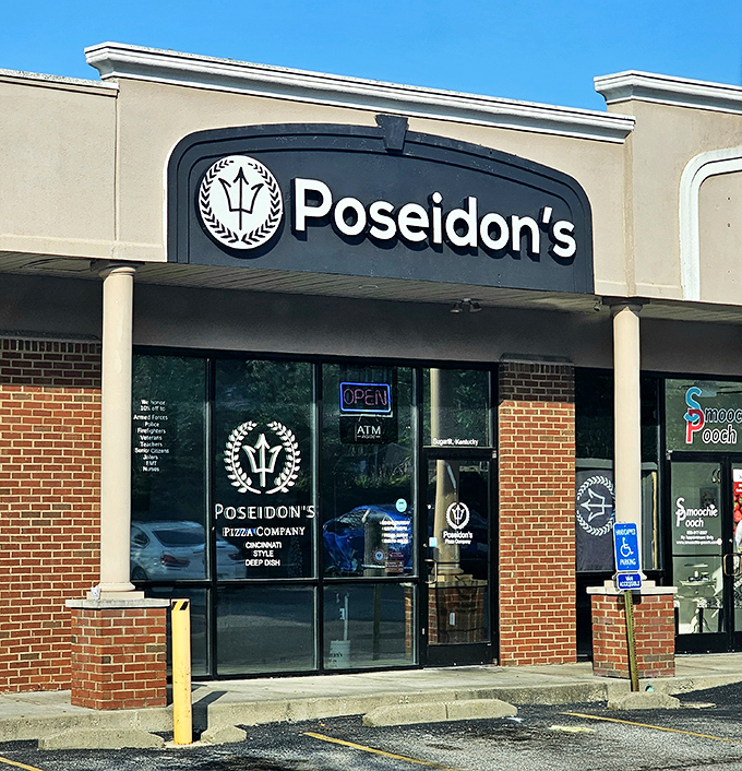 That clean, welcoming storefront promises the kind of neighborhood pizza that keeps families coming back.