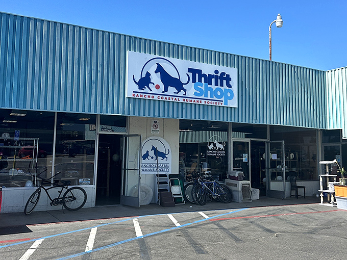 The Rancho Coastal Humane Society Thrift Shop's teal building houses treasures that help furry friends. That cat-and-dog logo says it all.