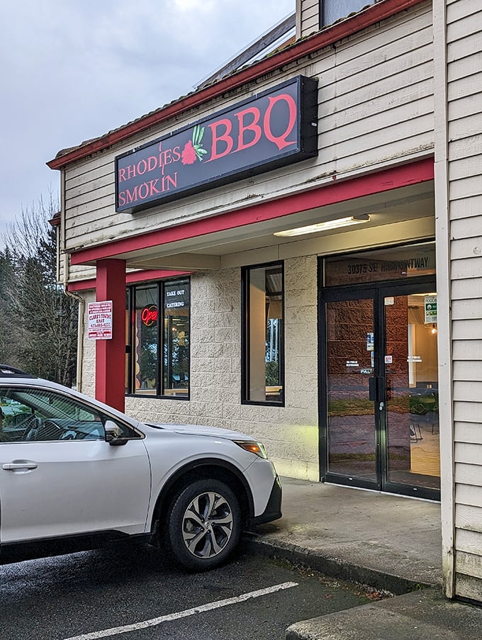 Rhodies' simple storefront promises smoky delights within. No fancy frills needed when your meat speaks for itself.