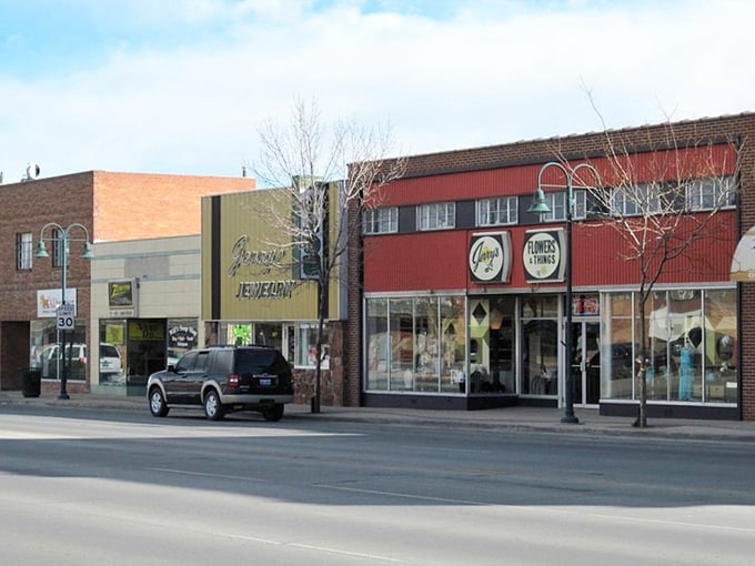 Charming storefronts line Riverton&rsquo;s main street, where friendly local businesses and colorful signs create a welcoming small-town Wyoming atmosphere.