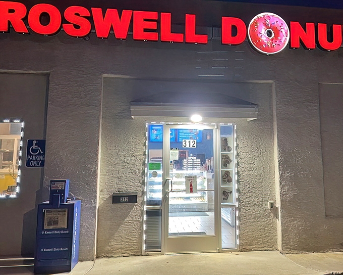 By night, Roswell Donuts glows like a UFO of sweetness. Coincidence? The truth is in there, between layers of perfectly fried dough.