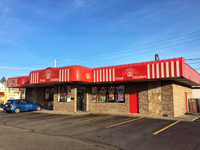 Royal Fried Chicken's regal red awning and crown logo &ndash; where every customer gets the royal treatment, chicken-style.