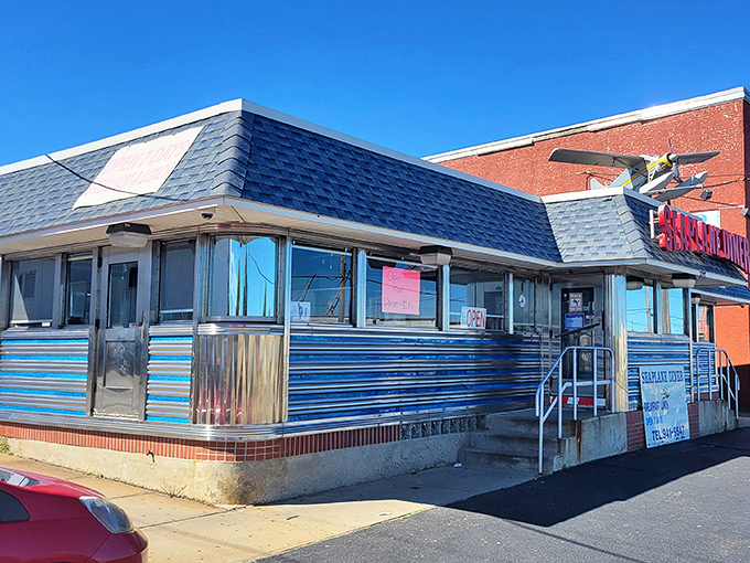 Seaplane Diner's polished exterior reflects both sunlight and Rhode Island history. That airplane on the sign isn't just cute&mdash;it's a promise of food that soars.
