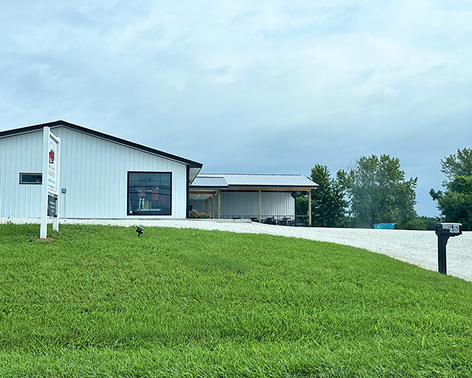 The white barn on the hill looks almost too picturesque for a smokehouse serving serious competition-worthy barbecue.