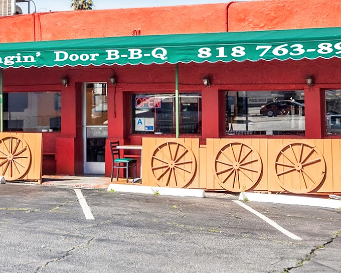 Wagon wheels and bright red walls &ndash; Swingin' Door's exterior is as bold as the flavors smoking inside.