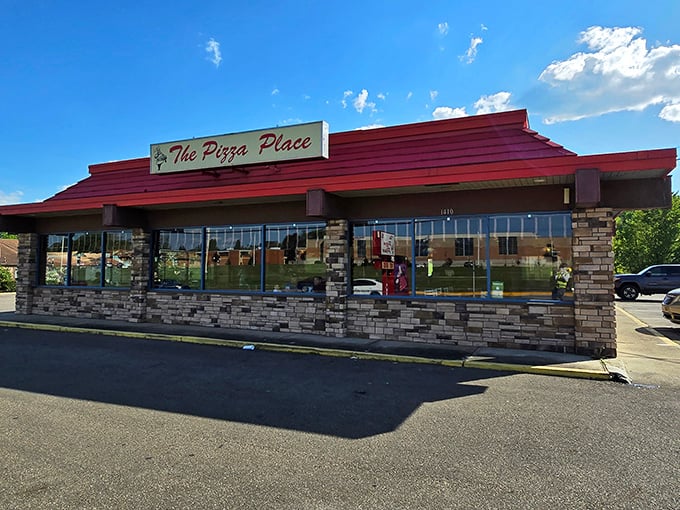 The Pizza Place's distinctive red roof signals you've arrived at pizza nirvana &ndash; no fancy name needed when the food speaks volumes.
