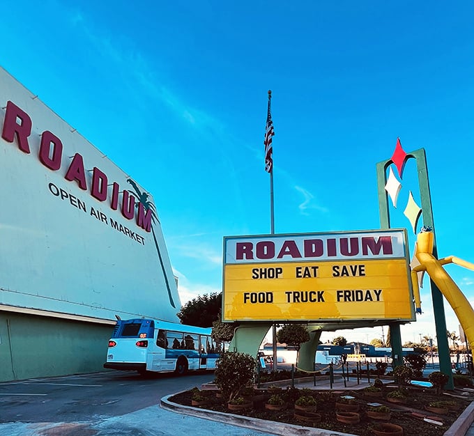 The Roadium's retro sign beckons bargain hunters with its mid-century charm and promise of treasures.