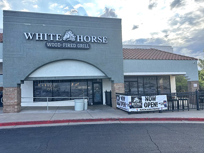 White Horse's modern facade houses ancient cooking wisdom: fire plus meat equals happiness. Simple math, delicious results!