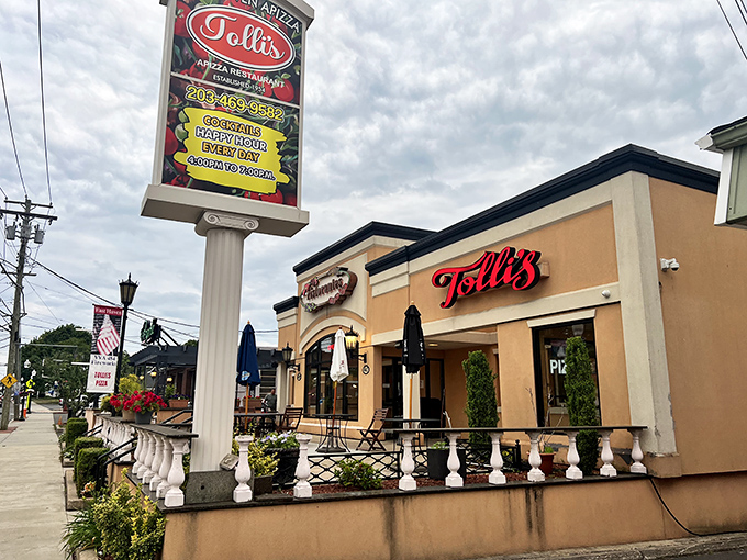 Tolli's Mediterranean-inspired exterior sets the stage for pizza drama. That outdoor patio? Perfect for pizza people-watching while savoring every bite.