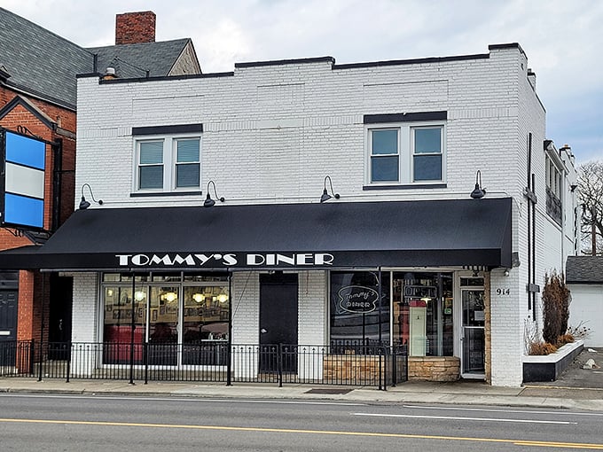 Tommy's Diner's sleek black awning and classic brick storefront - where Columbus comes for breakfast that puts chains to shame.