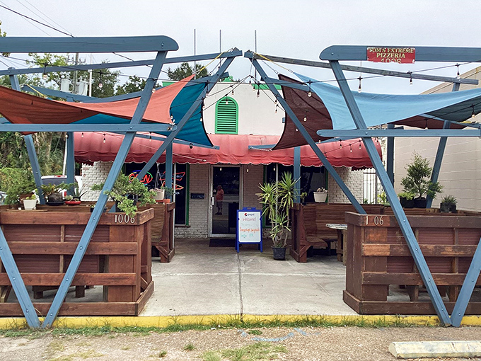Tom's Extreme Pizzeria's colorful canopy playground. Where pizza meets Cirque du Soleil in the best possible way!