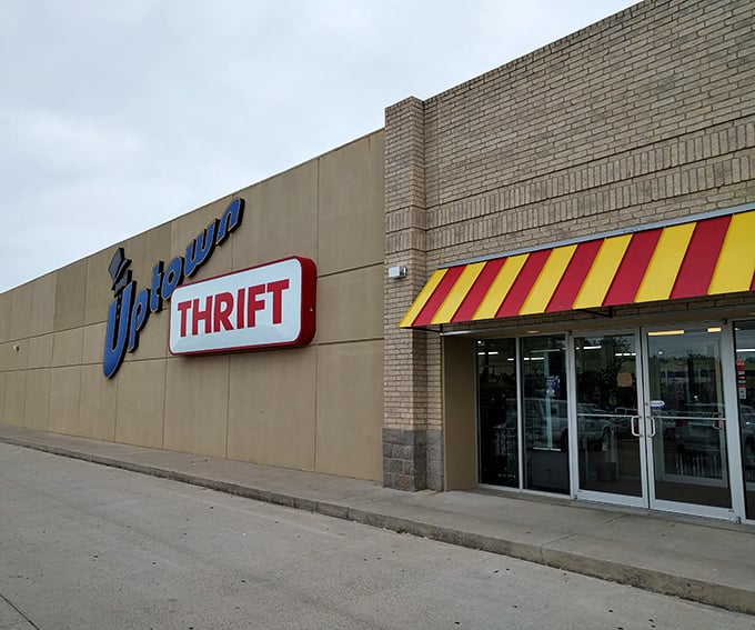 Uptown Thrift's bold blue signage stands out like a bargain-hunting bullseye. What treasures hide behind those brick walls?