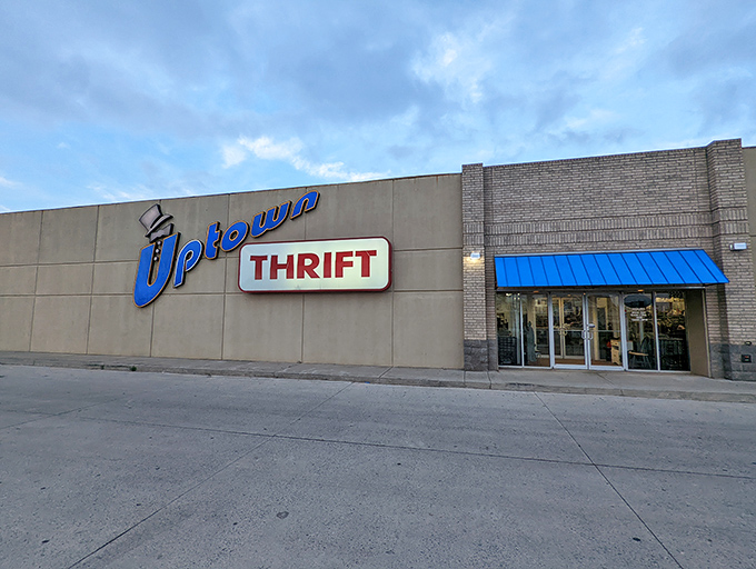 That jaunty blue script with its dapper top hat practically tips its brim at you &ndash; Uptown Thrift's fa&ccedil;ade screams "affordable class."