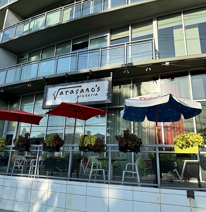 Varasano's modern storefront with cheerful red umbrellas promises a slice of sophisticated pizza heaven in Buckhead.
