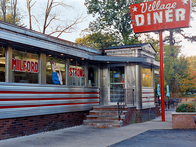 The Village Diner's vintage sign has called to hungry travelers since the days when tail fins ruled the roads.