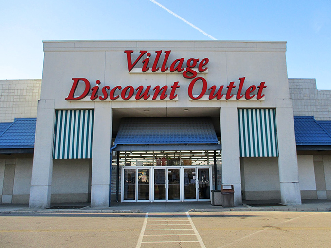 Village Discount Outlet's bold red letters practically shout "BARGAINS INSIDE!" A thrifter's paradise awaits.