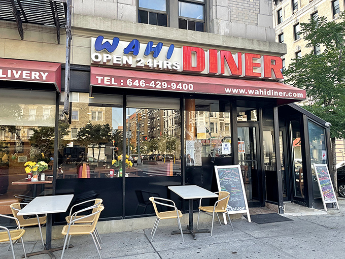 WaHi Diner's bold sign is like a 24-hour breakfast bat signal for hungry New Yorkers. Omelets at midnight? Absolutely!