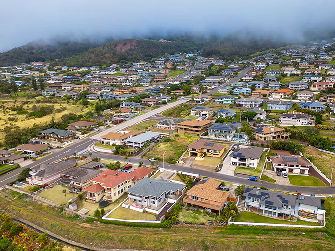 Mountain mist creates a dreamy backdrop for this charming residential hillside neighborhood community.
