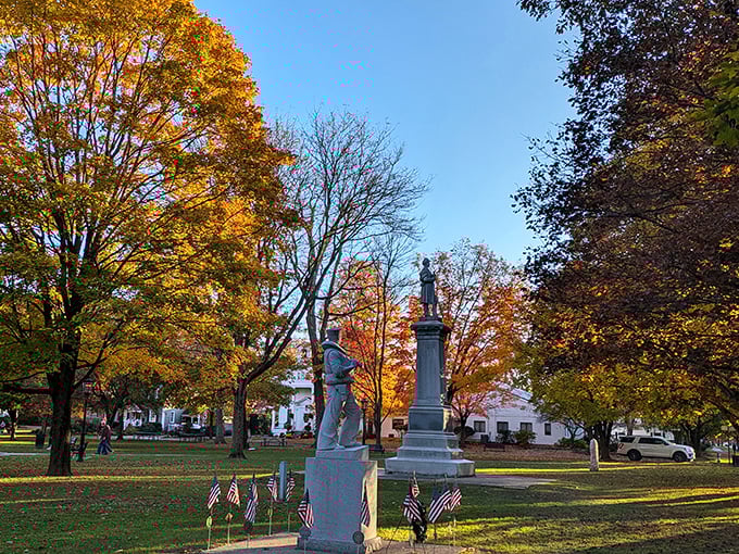 Wellsboro's town green glows with autumn magic, where historic monuments stand among trees dressed in their fall finest&mdash;nature's own fireworks display.
