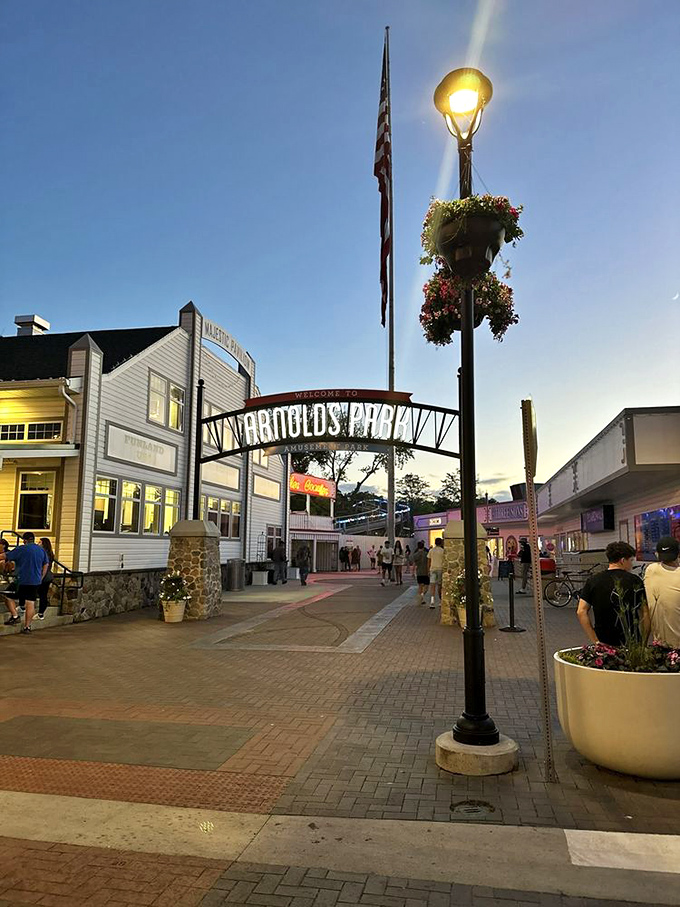 Evening strolls through Arnolds Park feel like stepping into a Norman Rockwell painting come alive.