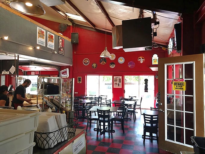 Red walls, checkered floors, and pizza worth writing home about. Back Road's casual vibe lets the food take center stage.