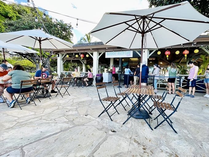 Lanterns sway as diners play at Barefoot Beach Cafe's stone patio&mdash;where the dress code is simply "whatever you wore in the ocean today."