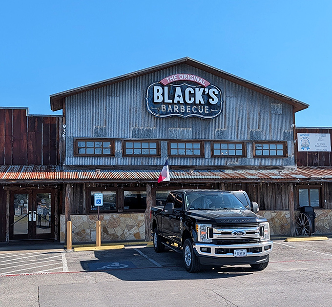 The pickup trucks in Black's parking lot tell you everything. When locals choose a barbecue joint, pay attention.