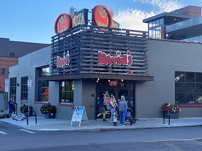 The neon "OPEN" sign at David's Pizza&mdash;three simple words that promise happiness: "hand-crafted" and "pizza."