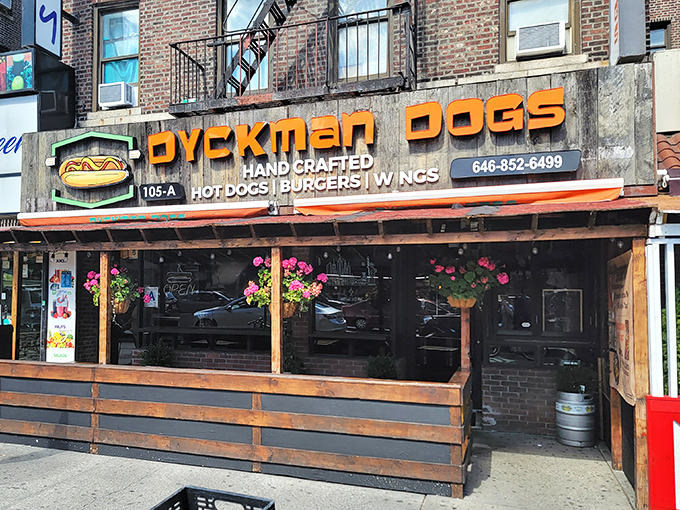 Wooden benches, string lights, and sausage delights! Dyckman's outdoor setup is like your coolest friend's backyard BBQ.