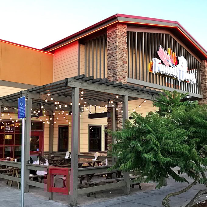 BBQ lodge vibes! Stone columns and wooden beams frame a meat sanctuary where comfort food reigns supreme.