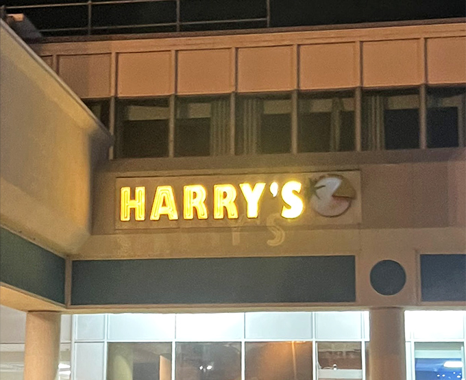 Harry's sign illuminates the night like a beacon for the pizza-starved. That glow promises salvation from mediocre dinner options.