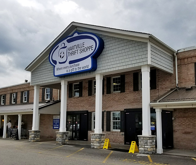 The pillared entrance of Hartville Thrift Shoppe adds a touch of class to thrifting. Yellow fire lanes keep the bargain emergencies organized.