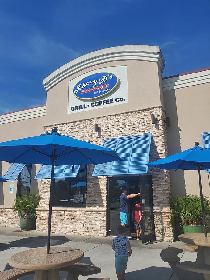 Johnny D's Waffles: Those blue umbrellas aren't just for show—they're sheltering serious breakfast conversations and vacation-worthy waffle decisions.