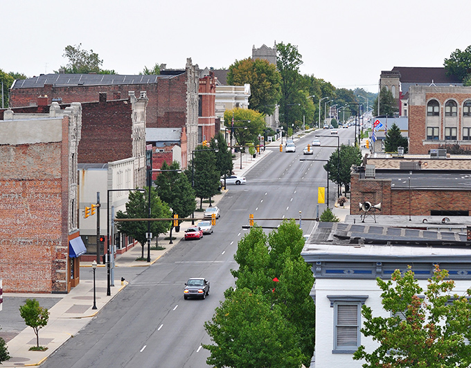 The aerial view reveals Logansport&rsquo;s long, steady avenue framed by classic buildings and leafy streets, a community that wears its history with easygoing pride.