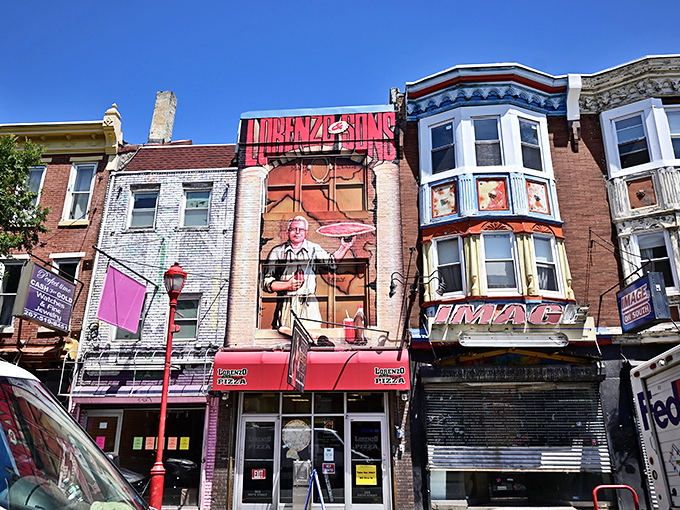 The colorful mural above Lorenzo's adds to South Street's vibrant character &ndash; much like their oversized slices.