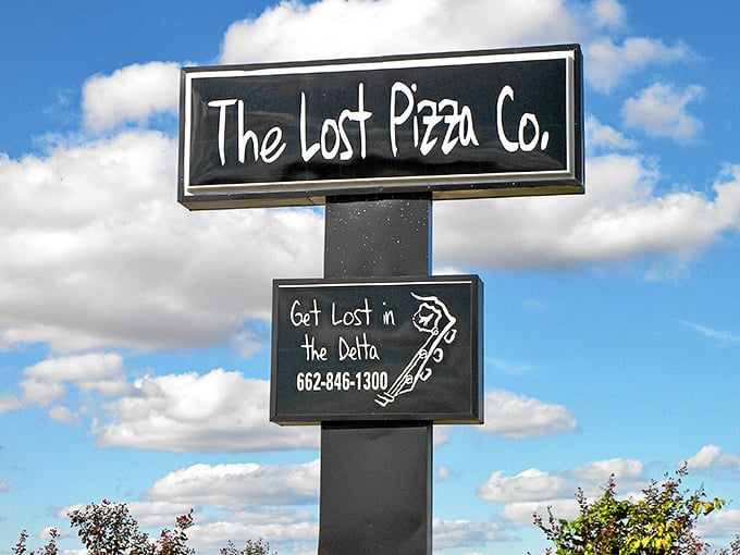"Get Lost in the Delta" invites this charming roadside sign. Pizza adventures await just beyond those doors!