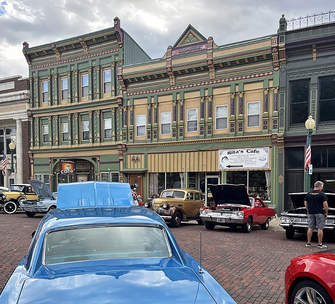 Vintage cars cruise past colorful facades, making every day feel like a step back to simpler times.