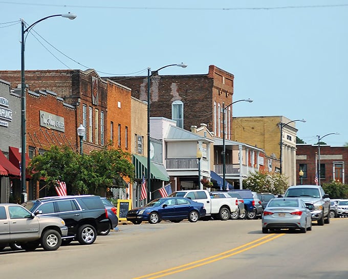 Historic brick buildings line streets where every storefront tells a story worth discovering on foot.