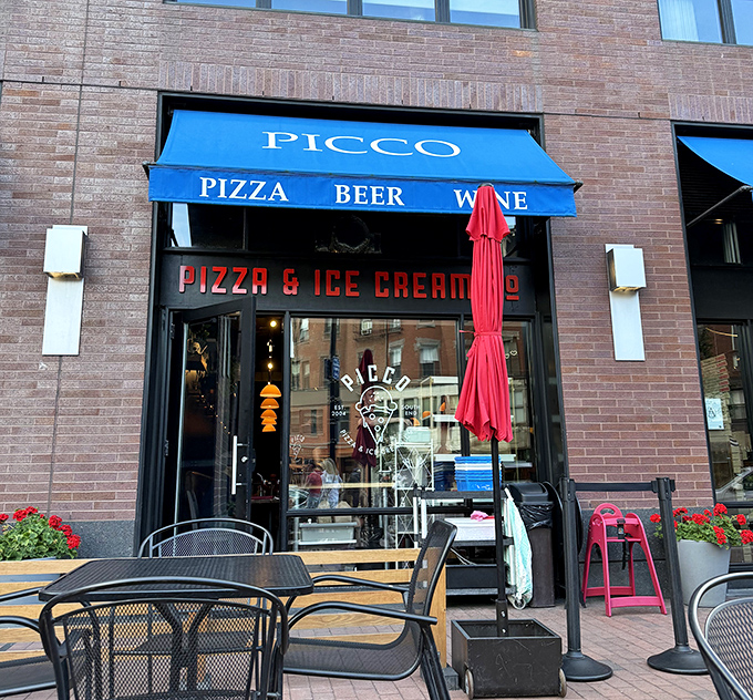Outdoor seating, red umbrellas, and pizza worth lingering over&mdash;Picco turns eating into the event it should be.