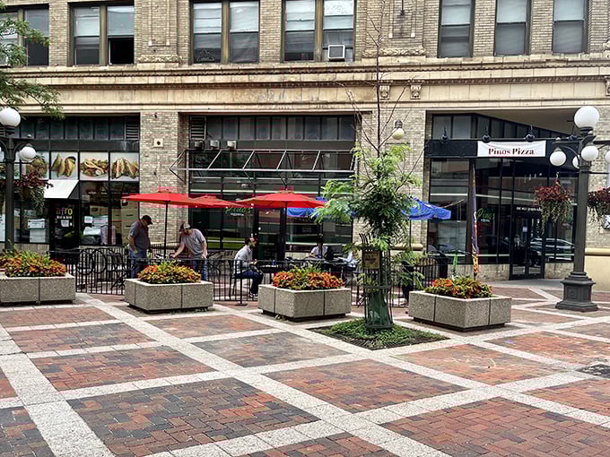 Street-side seating where pizza meets people-watching &ndash; downtown dining at its finest and most flavorful.
