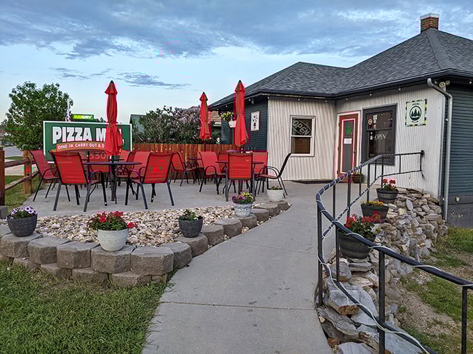 A pizza patio made for lingering. Those red umbrellas practically guarantee a good time with every slice.